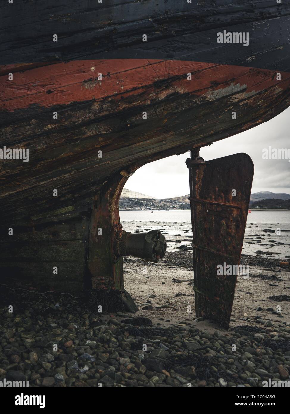 Ship wreck on the beach at low tide. The Old Boat of Corpach, Ben Navis ...