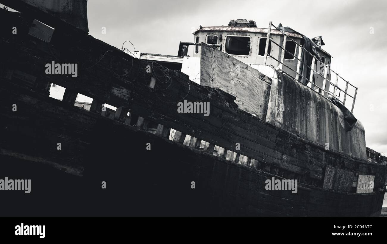 Ship wreck on the beach at low tide. The Old Boat of Corpach, Ben Navis ...