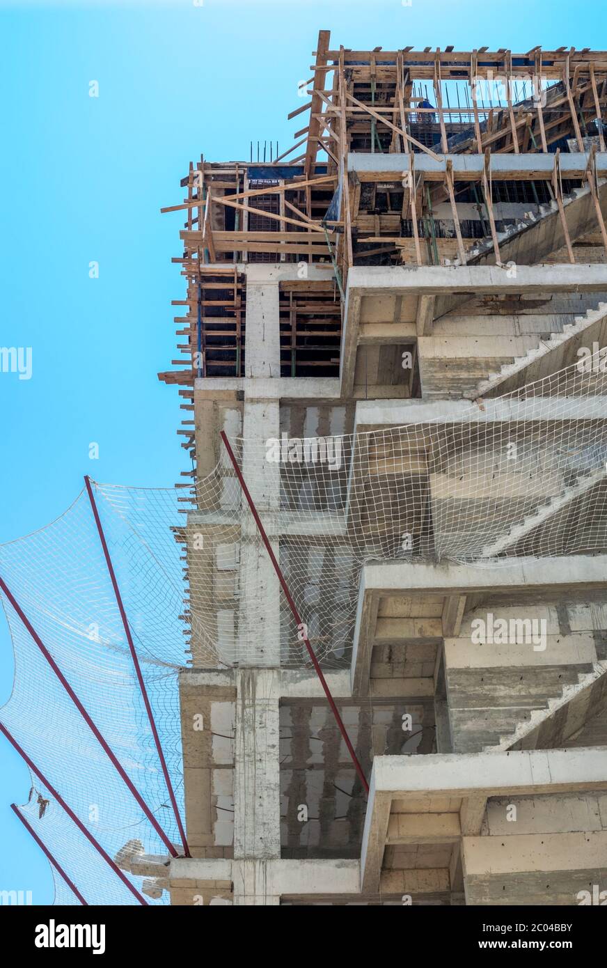 Low angle view of a building under construction with unfinished ...