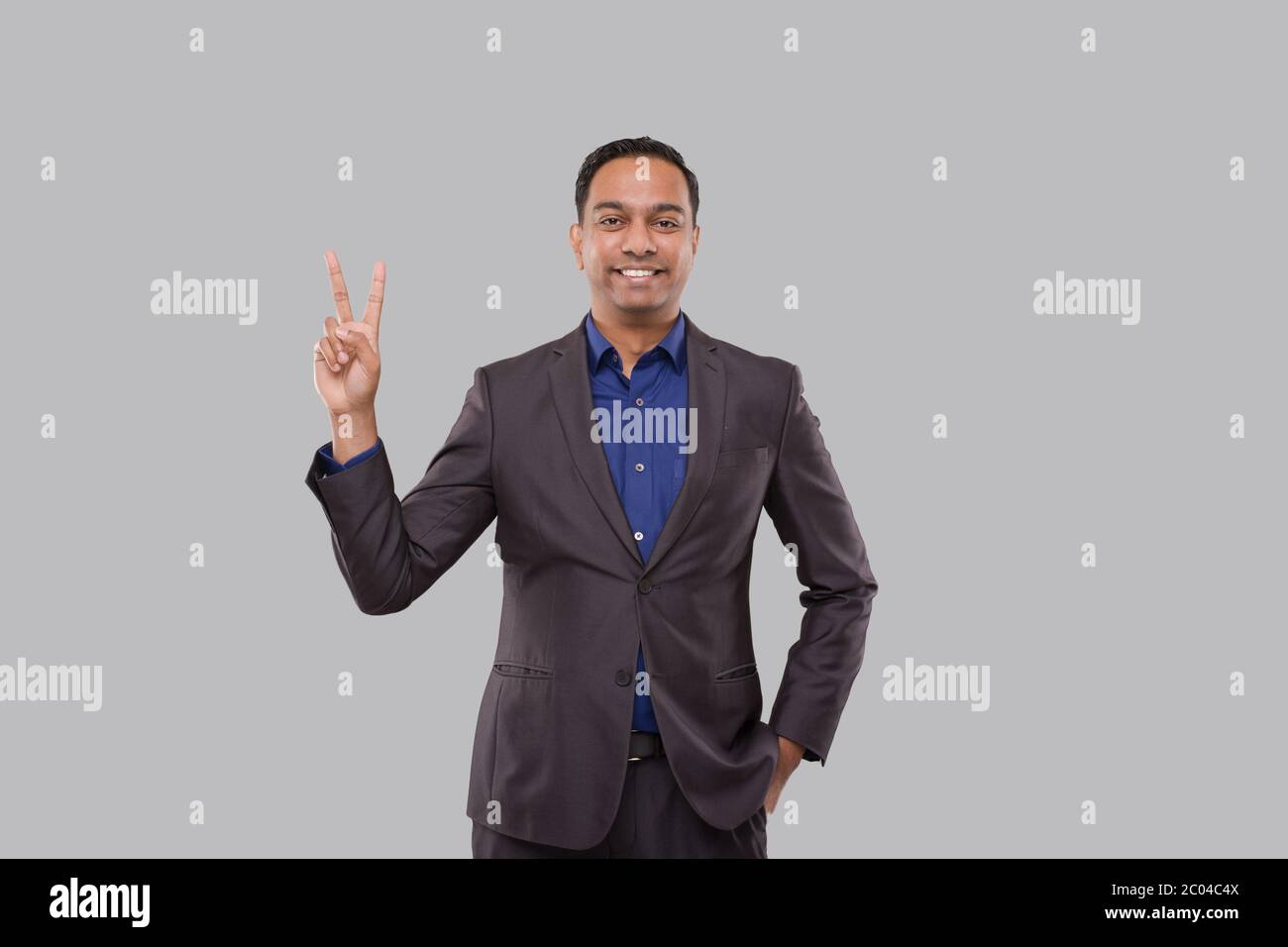 Businessman Showing Peace Sign Isolated. Indian Business man Standing ...