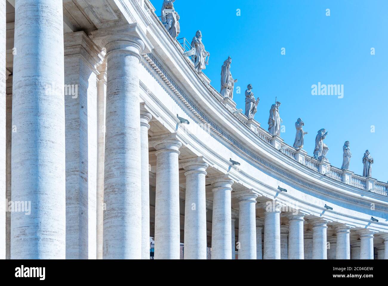Doric Colonnade with statues of saints on the top. St. Peters Square, Vatican City Stock Photo ...