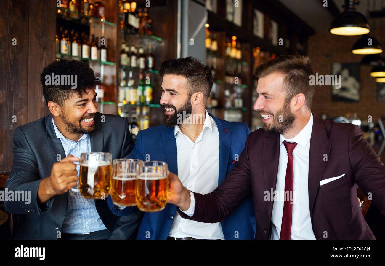 Handsome businessman drinking beer counter hi-res stock photography and ...