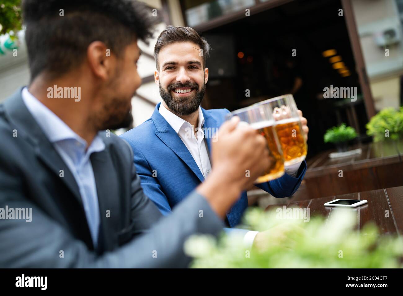 Business people drink beer after work. Businessmen enjoy a beer Stock ...