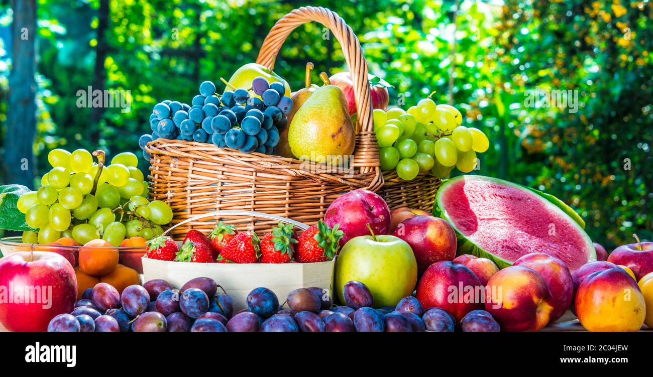 Variety of fresh ripe fruits in the garden. Balanced diet Stock Photo ...