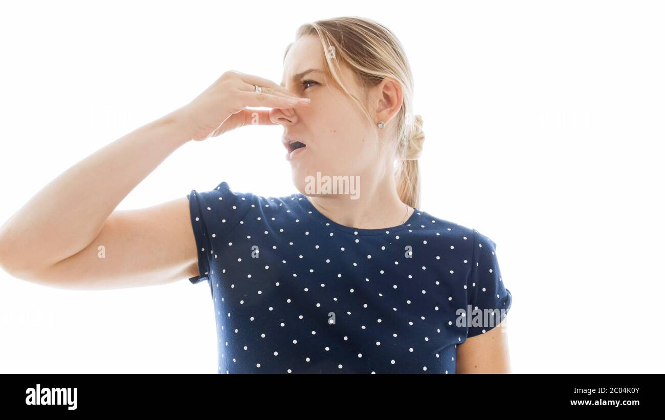 Isolated portrait of woman closing her nose after smelling stinky ...
