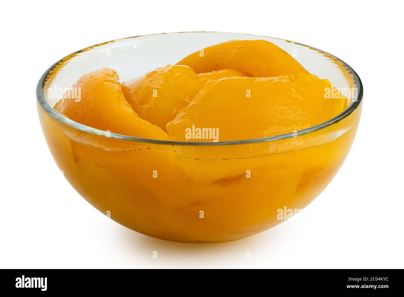 Canned mango slices in syrup in a glass bowl isolated on white. Low ...