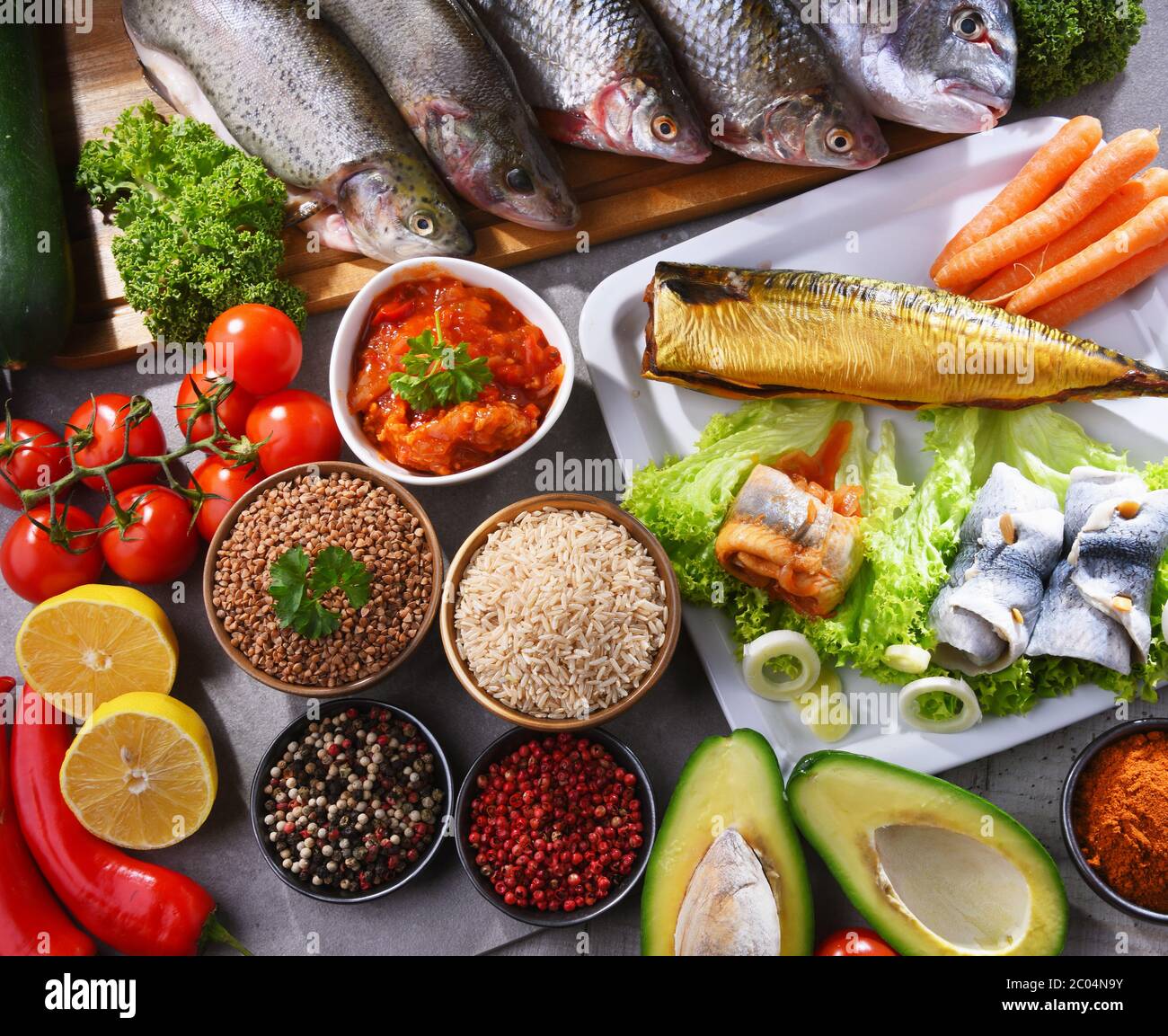 Different sorts of fish on kitchen table Stock Photo - Alamy