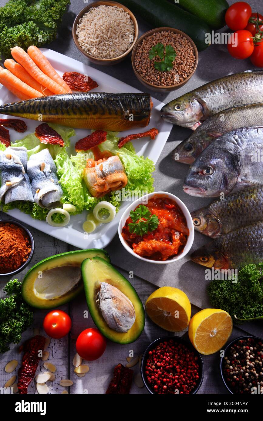 Different sorts of fish on kitchen table Stock Photo - Alamy