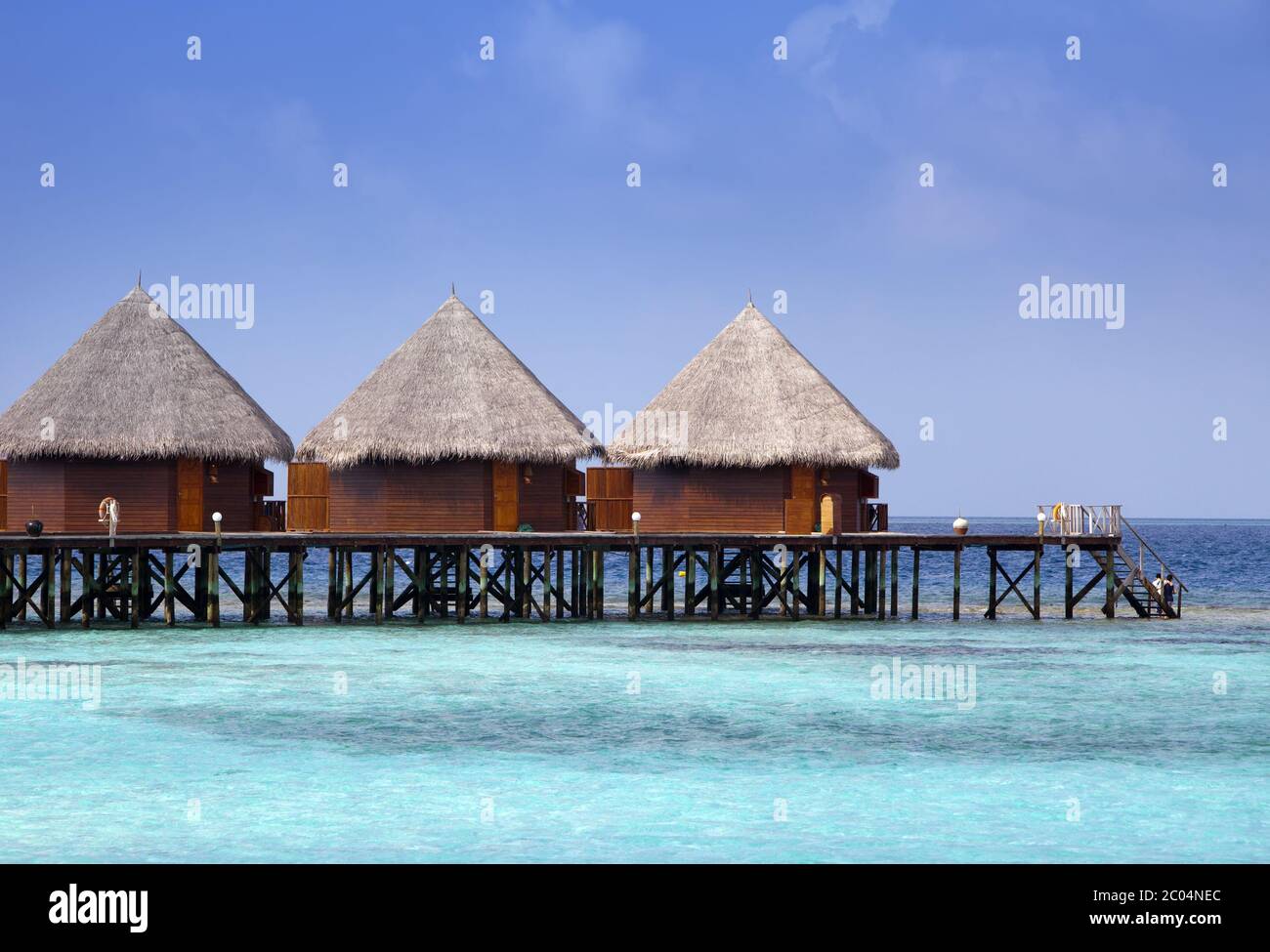 houses on piles on sea. Maldives Stock Photo - Alamy