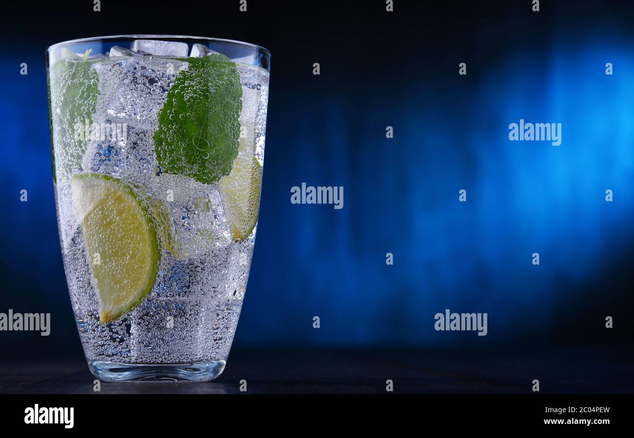 Glass of mineral water with ice, lime and mint Stock Photo - Alamy