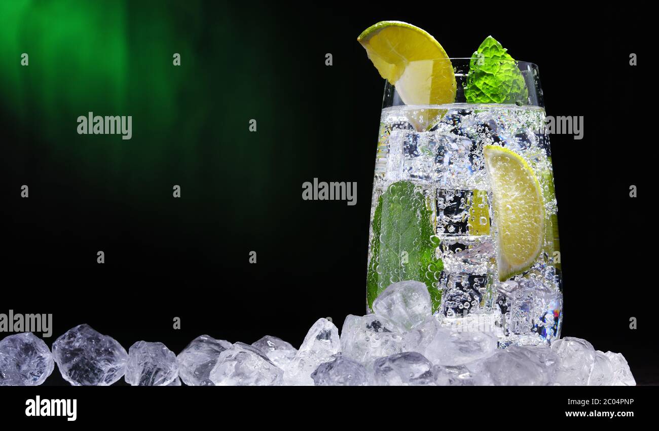 Glass of mineral water with ice, lime and mint Stock Photo - Alamy