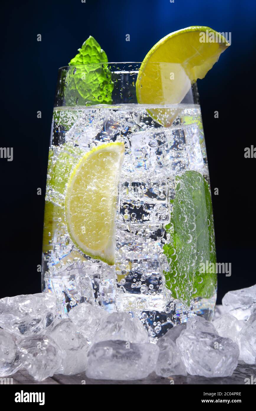 Glass of mineral water with ice, lime and mint Stock Photo - Alamy