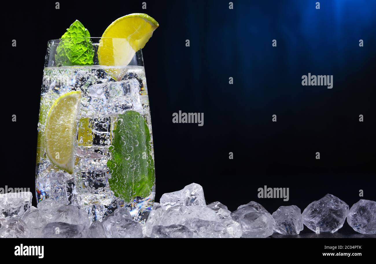 Glass of mineral water with ice, lime and mint Stock Photo - Alamy