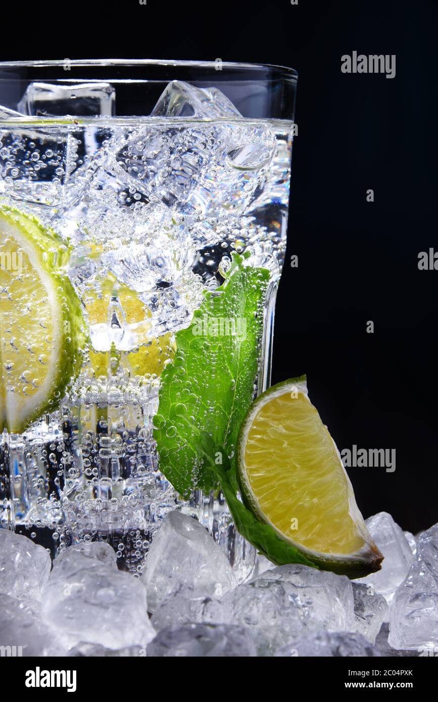 Glass of mineral water with ice, lime and mint Stock Photo - Alamy