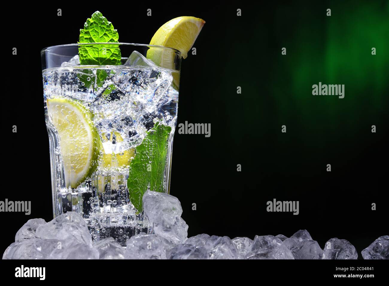 Glass of mineral water with ice, lime and mint Stock Photo - Alamy