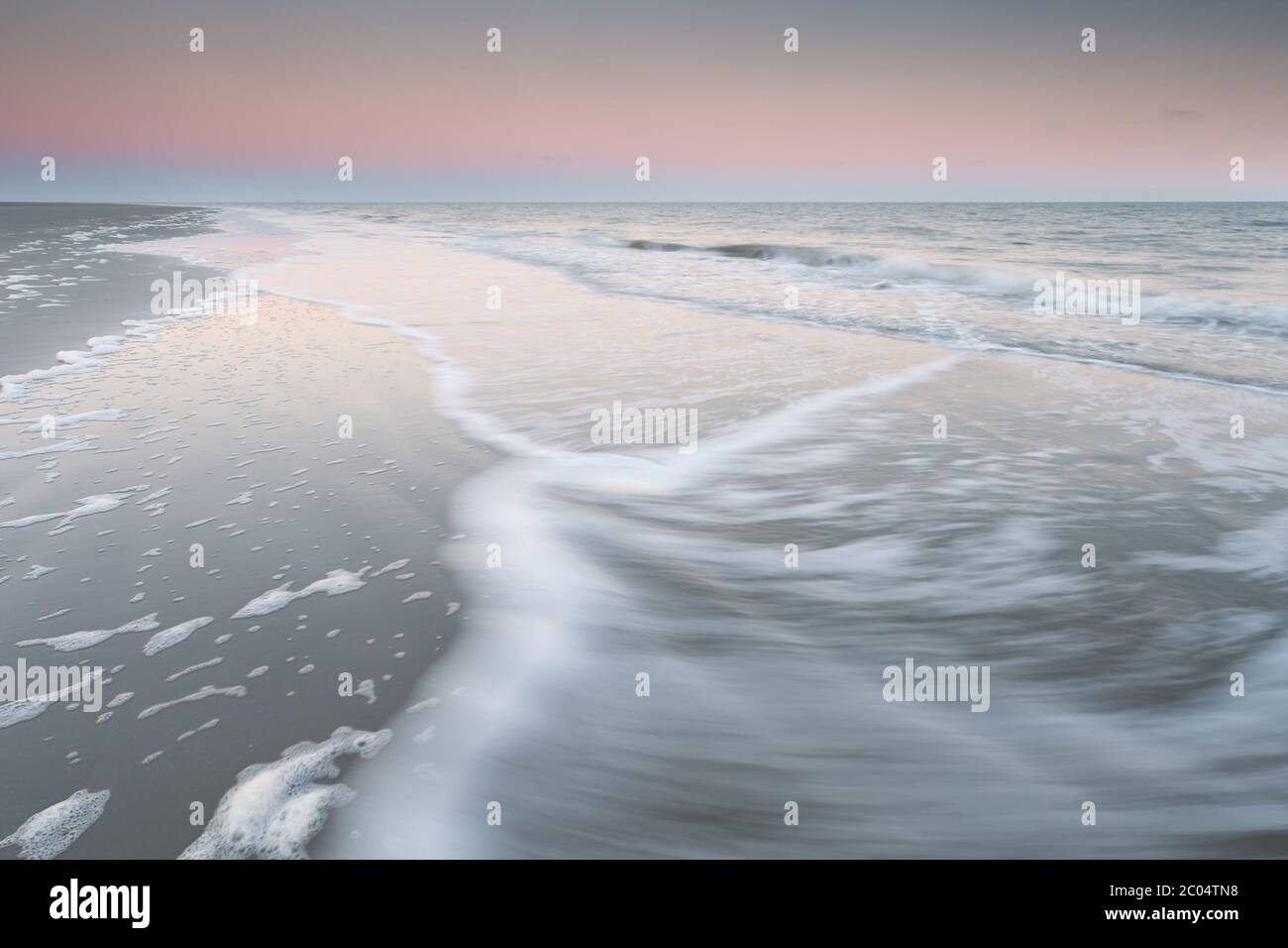 North sea waves at sunrise Stock Photo - Alamy