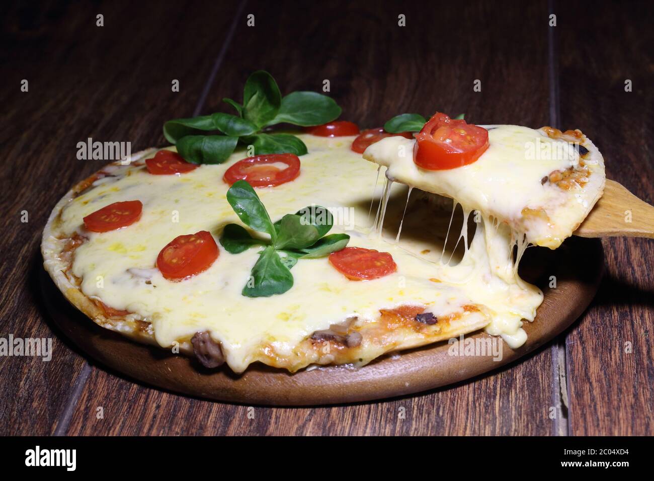 Melted cheese pizza hi-res stock photography and images - Alamy