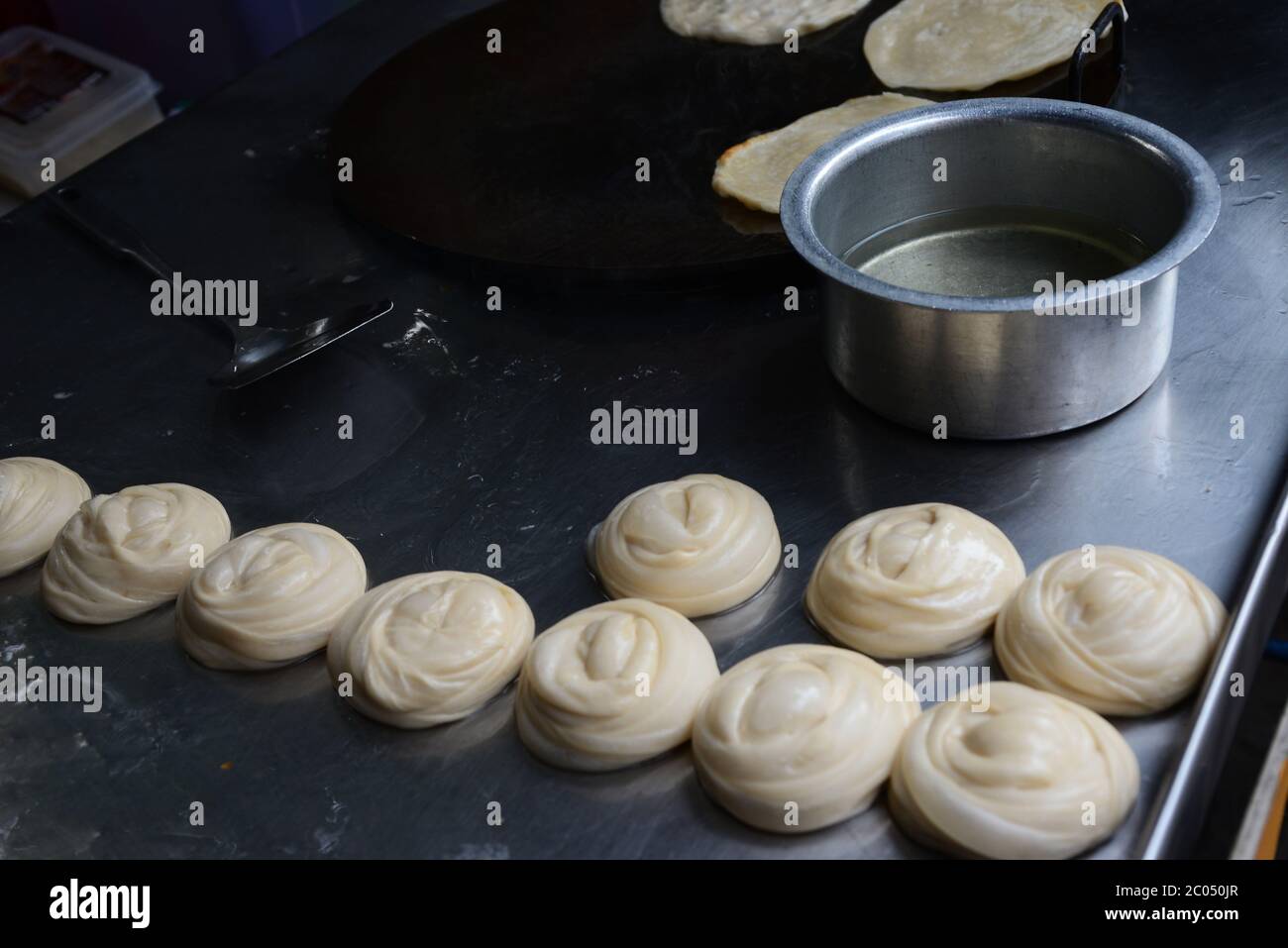 Soft focus of Roti Making with oil, white raw Roti thresh flour by ...