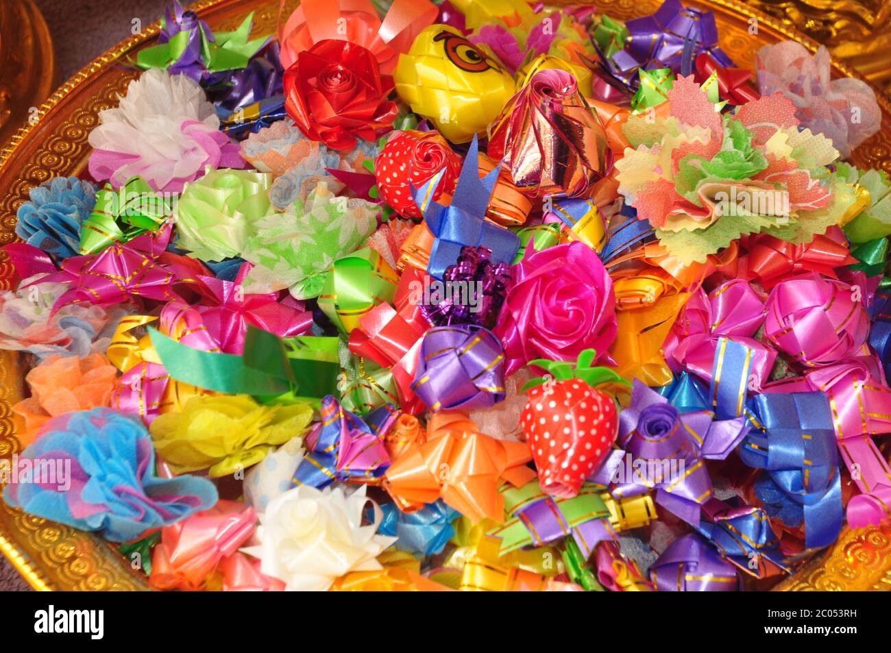 almsgiving with ribbon-flowers for giving alms to make merit in ...