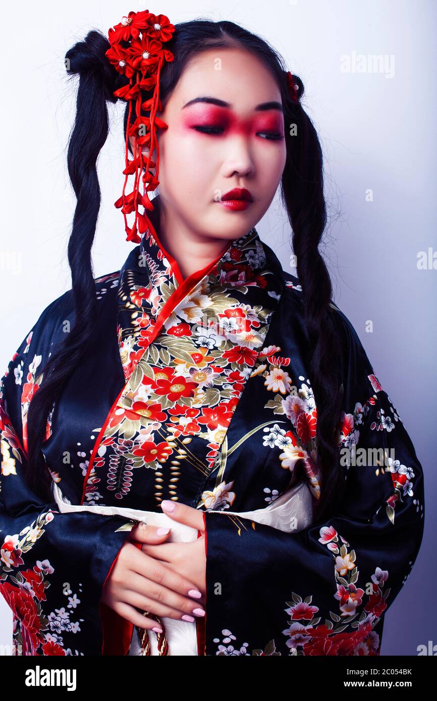 young pretty geisha in black kimono with sakura, asian ethno closeup on ...