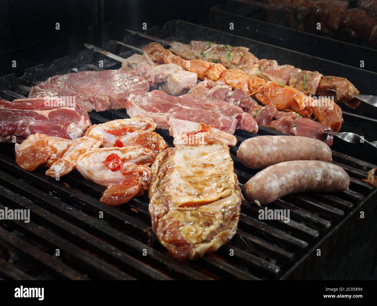 Cooking meat barbecue Stock Photo - Alamy