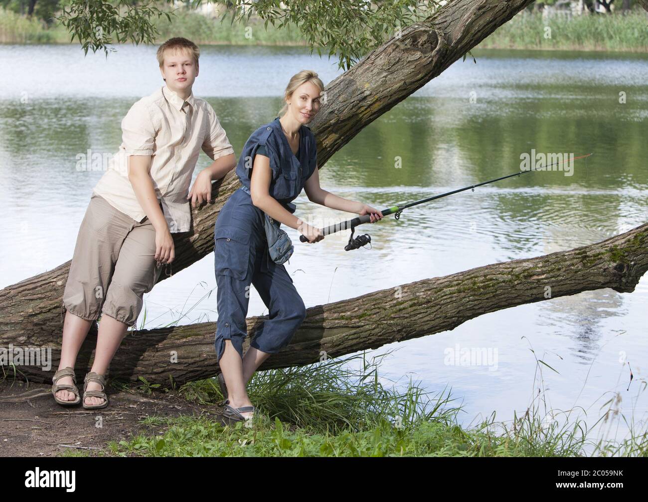 Young people on fishing Stock Photo - Alamy