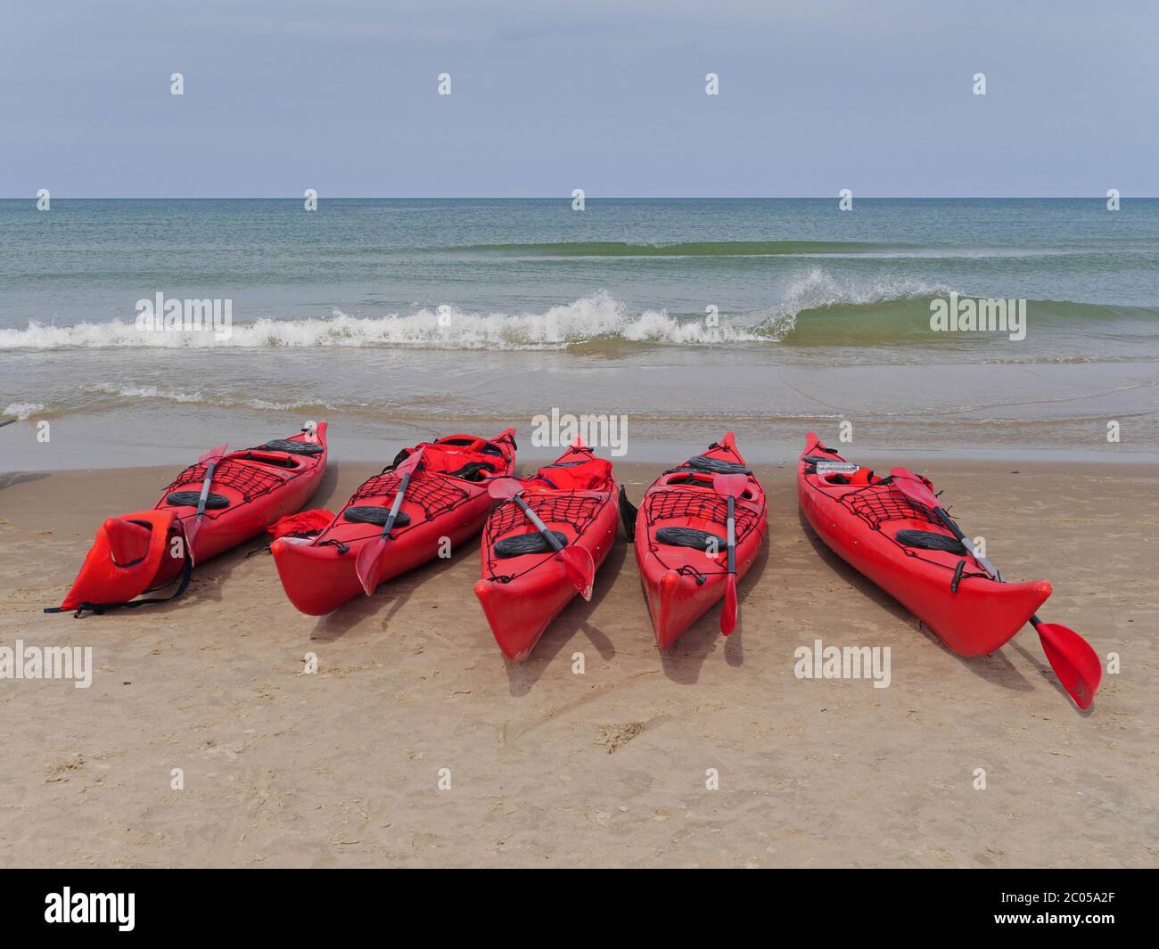 Canoes on the beach Stock Photo - Alamy