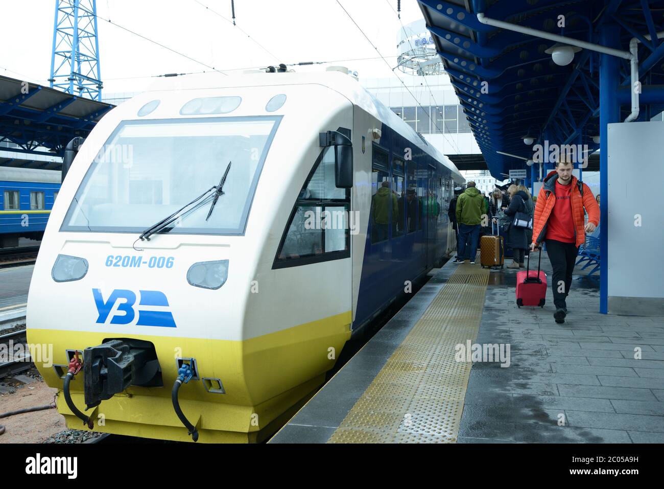 Group of passengers standing in front of doors of the passenger train ...