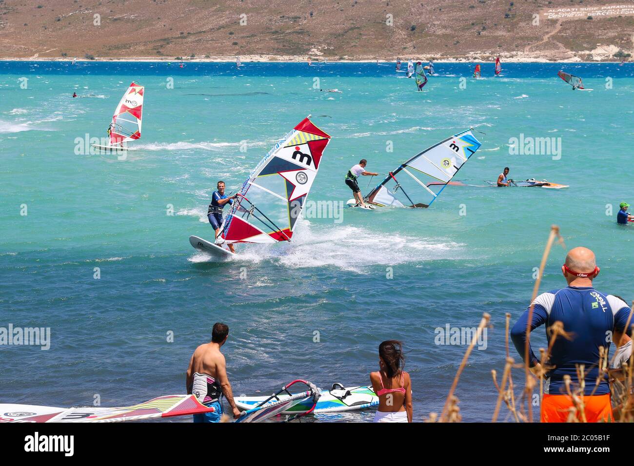 People watching surfer's turn trick during preparation session for PWA ...