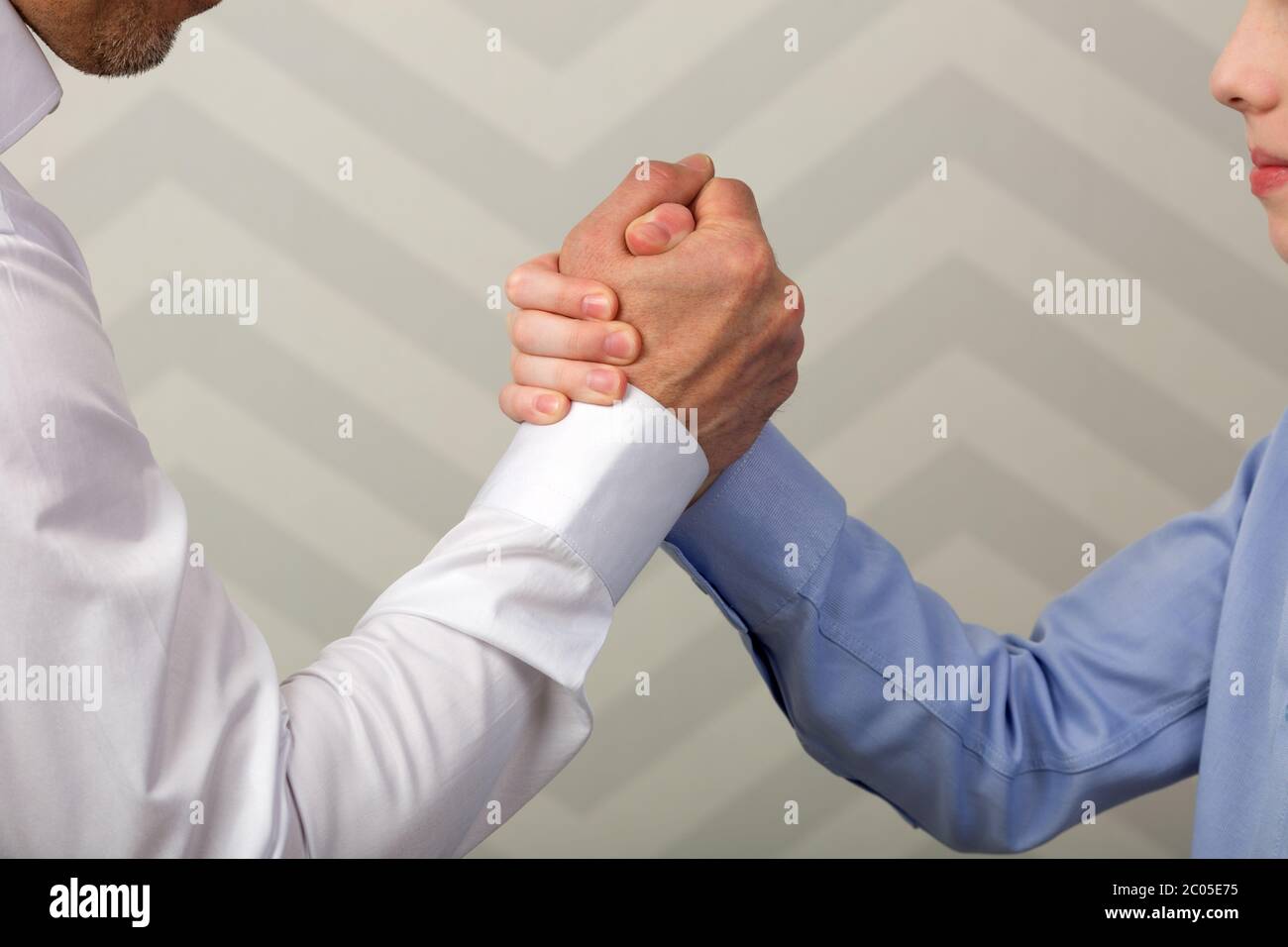 Strong handshake of father and son Stock Photo - Alamy