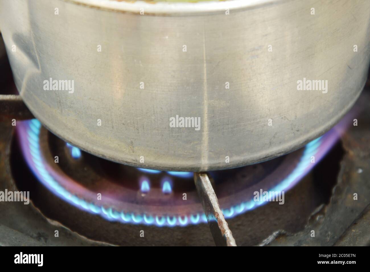 silver pot boiled on fire gas stove in kitchen Stock Photo - Alamy