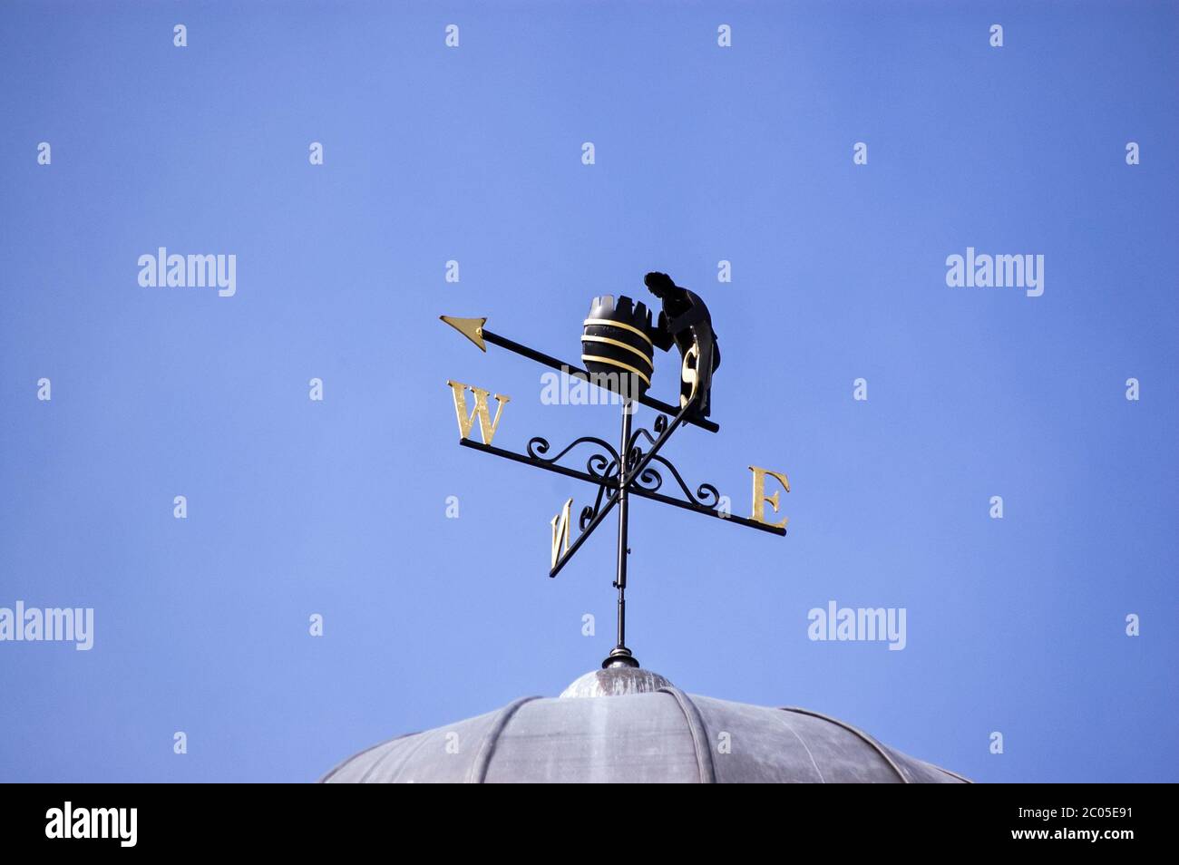 Landmark cooper making a barrel weather vane at the corner of Jesus ...