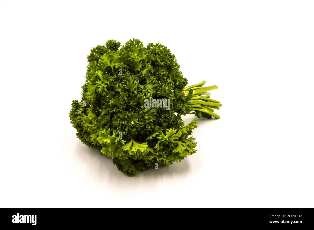 fresh bunch of parsley isolated on white Stock Photo - Alamy
