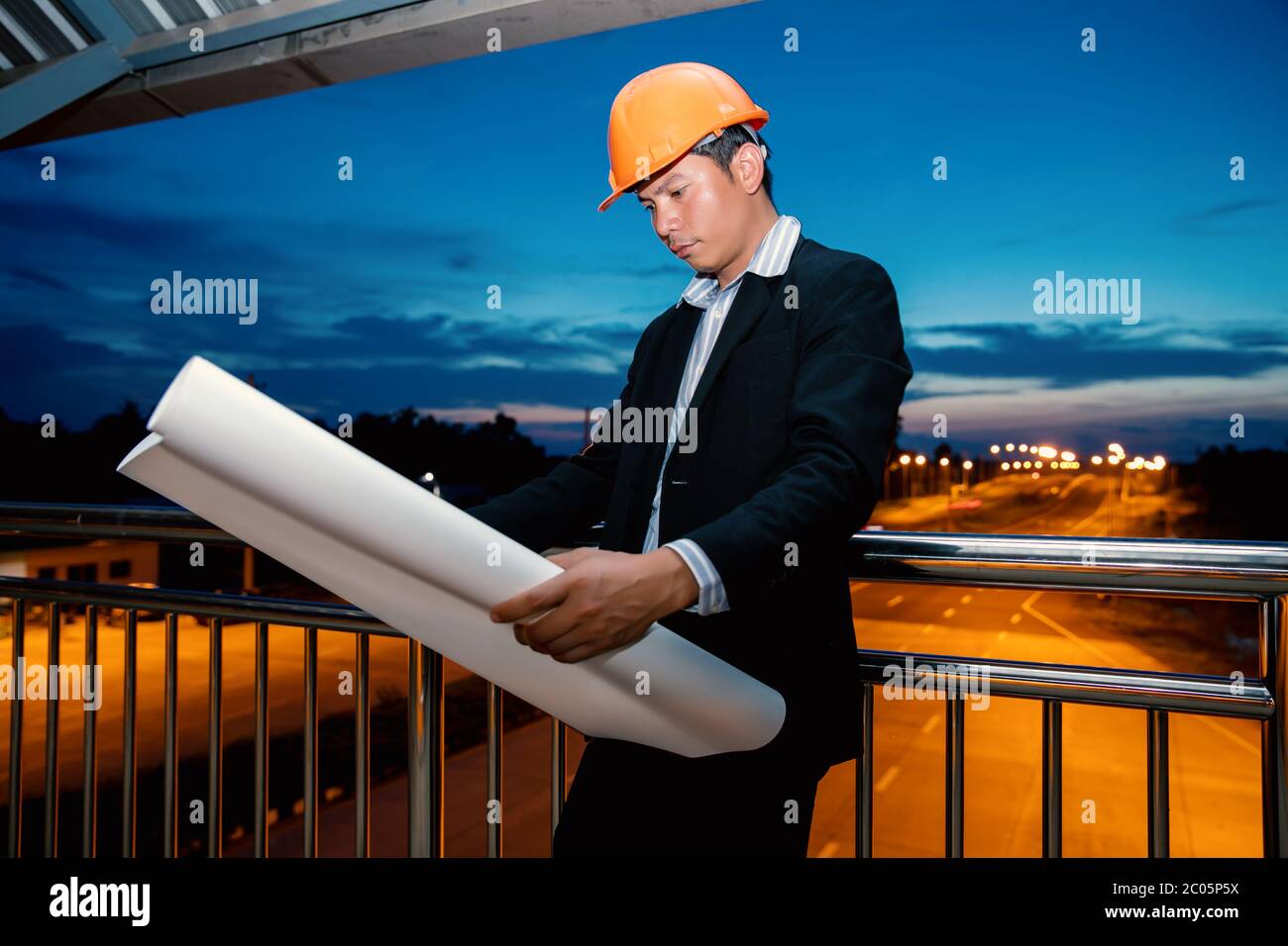 Two engineers standing on the bridge over the bridge Stock Photo - Alamy