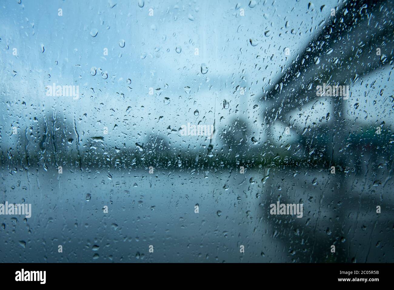 driving in heavy rain especially around vehicles. rain on a car window ...