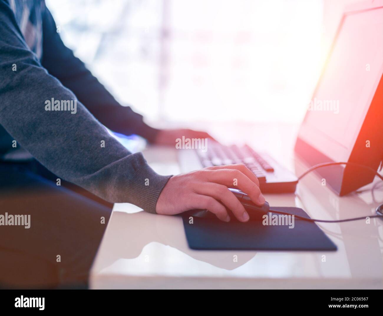 Male hand holding computer mouse with laptop keyboard Stock Photo - Alamy
