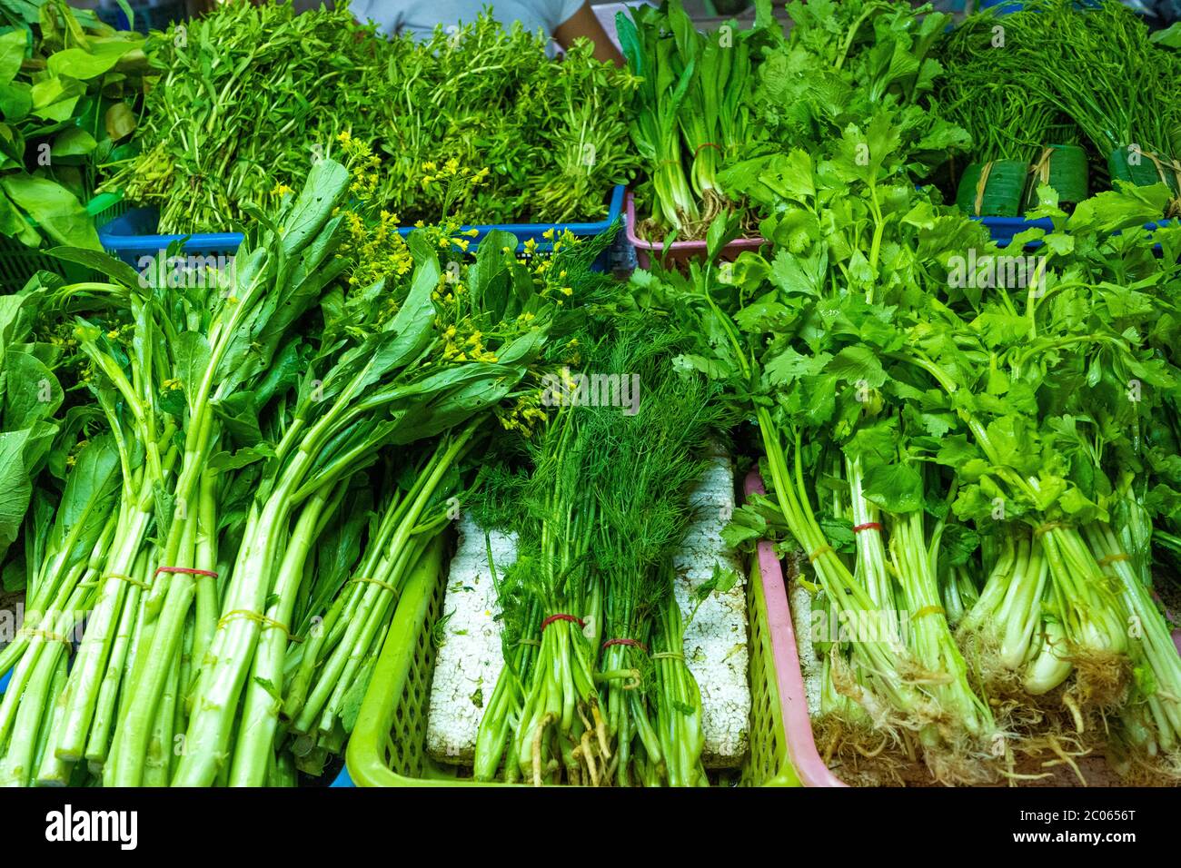 Boxes with greens on a counter at the vegetable market Stock Photo - Alamy