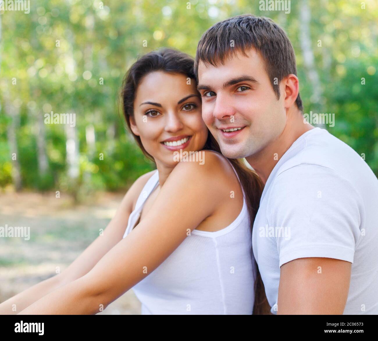 Portrait of a happy couple laughing at camera Stock Photo - Alamy