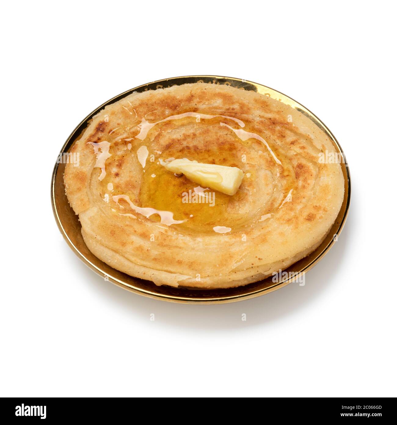 Single fresh baked meloui, Moroccan pancake with butter and honey close ...
