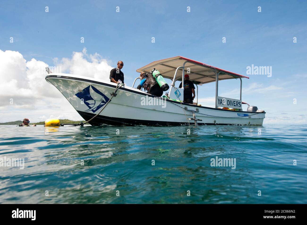 Diver in water at the dive boat, Yap Island, Micronesia, Caroline ...