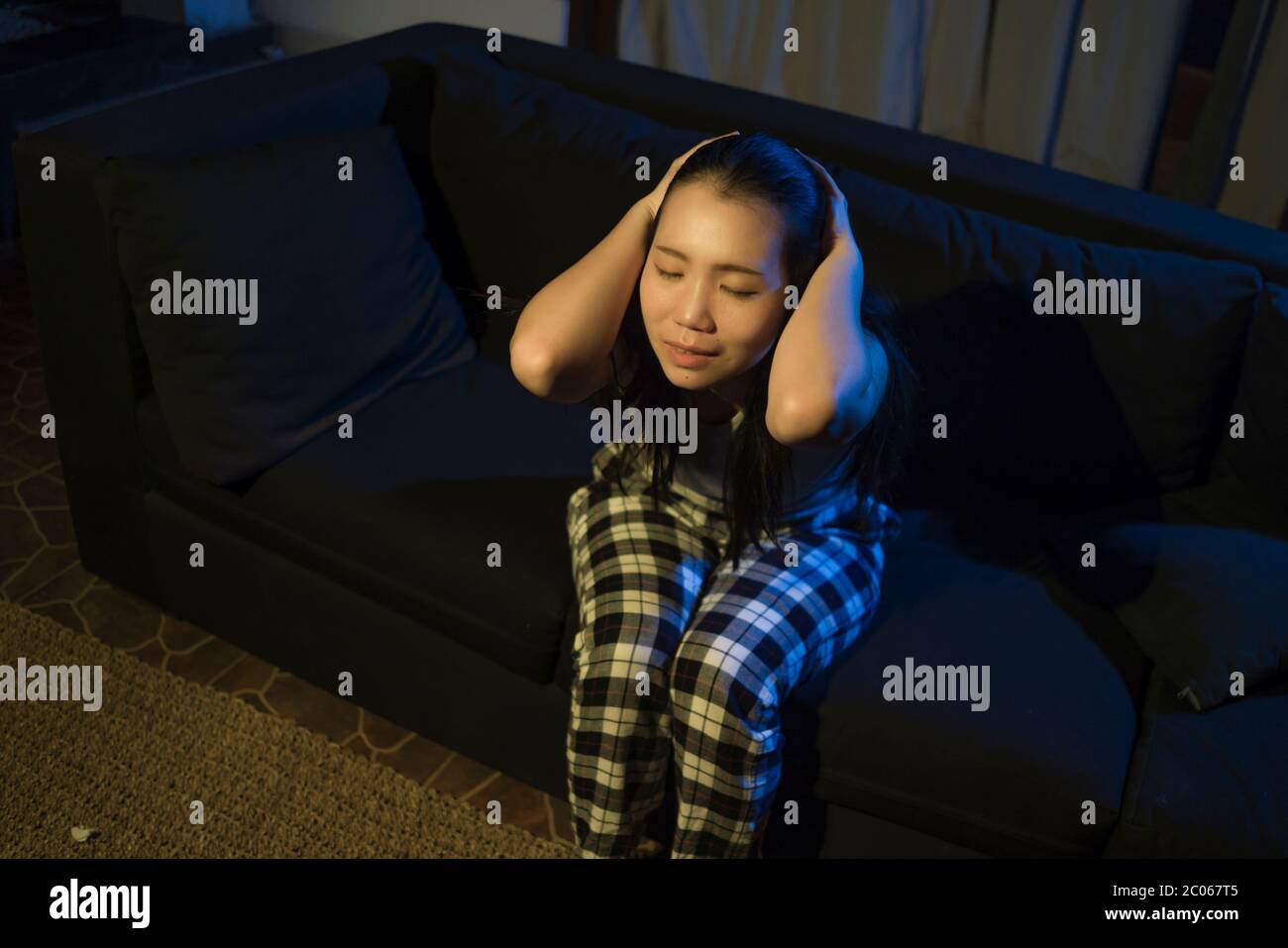dramatic home lifestyle portrait of young beautiful sad and depressed ...