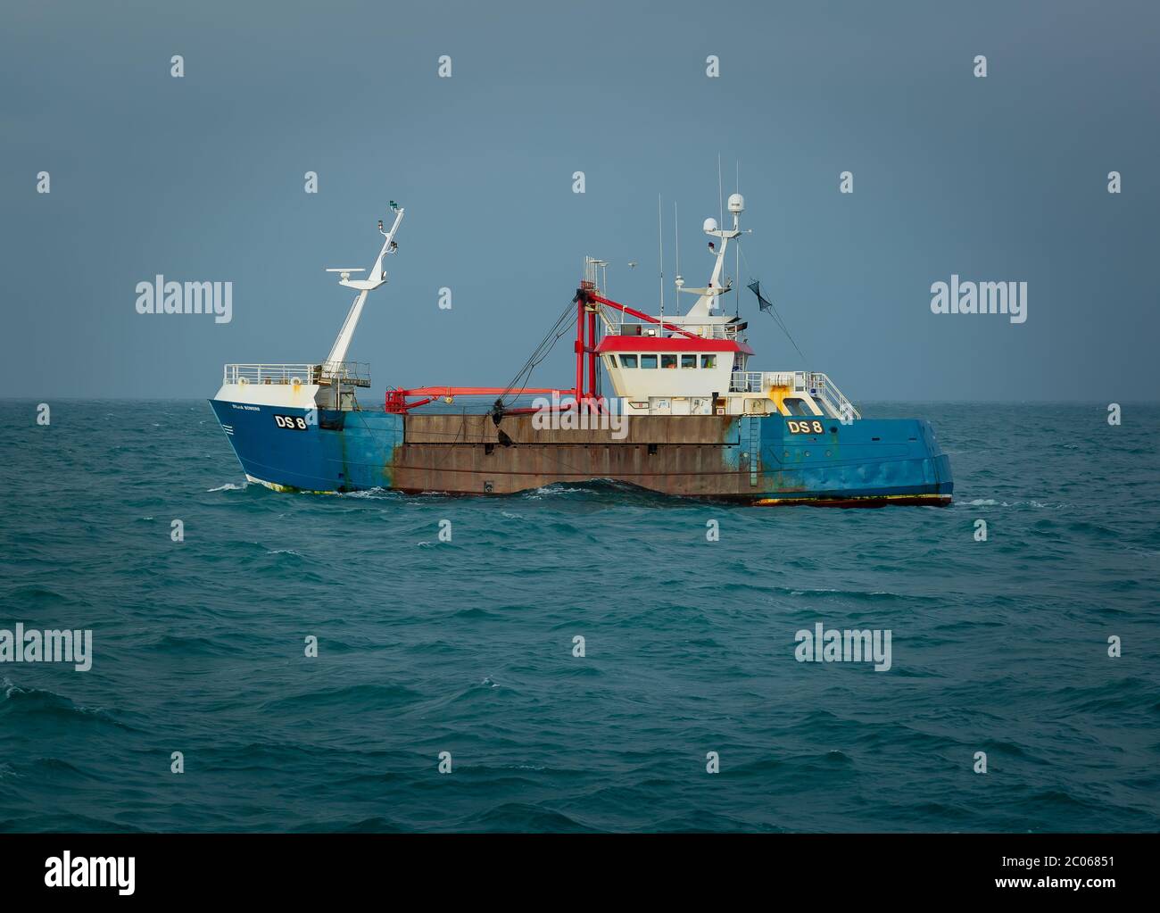 Fishing vessel towing her fishing gear Stock Photo - Alamy
