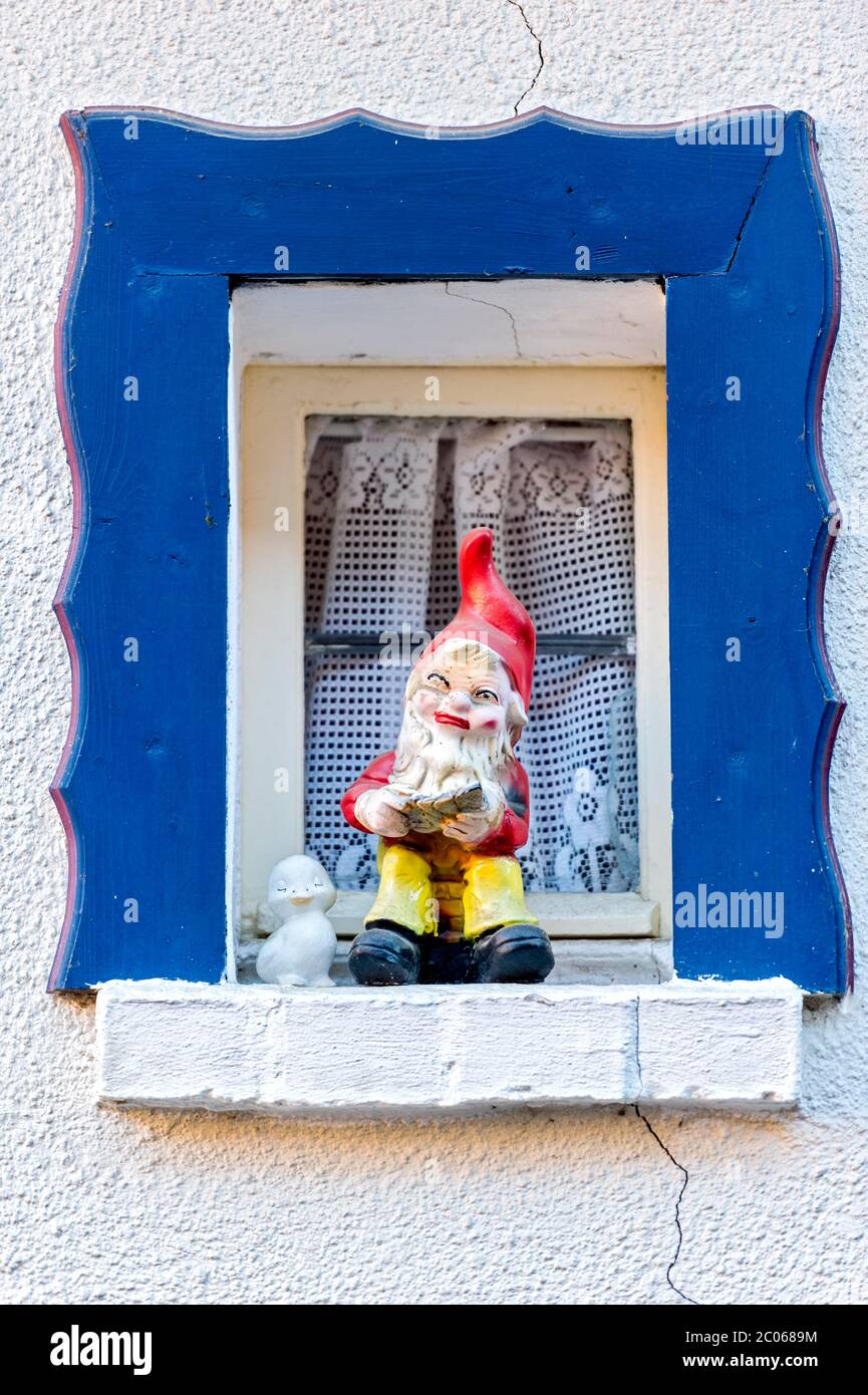 Garden gnome at small window, Steinau an der Strasse, Hesse, Germany ...