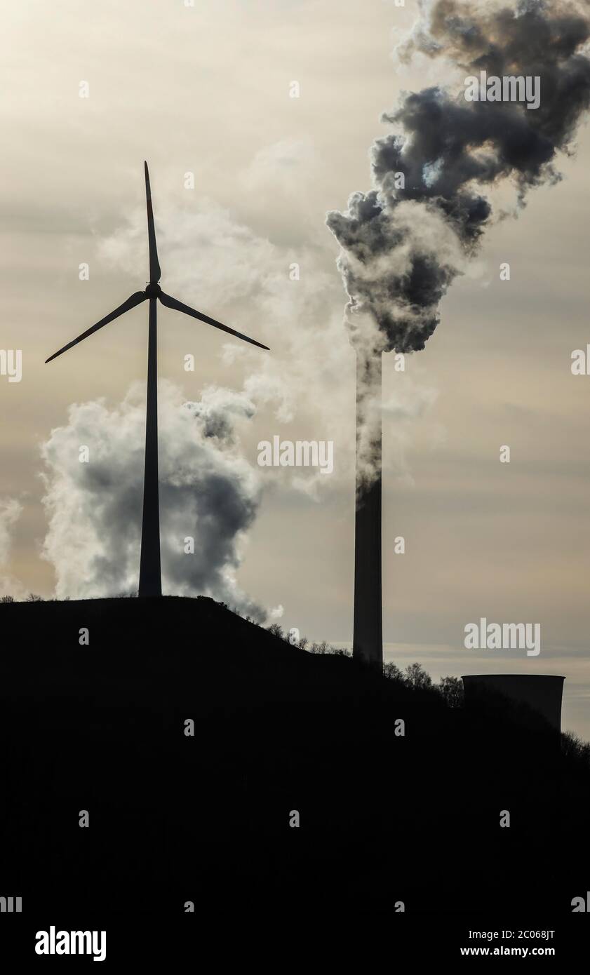 Wind turbine and smoking chimneys at the Uniper coal-fired power plant ...