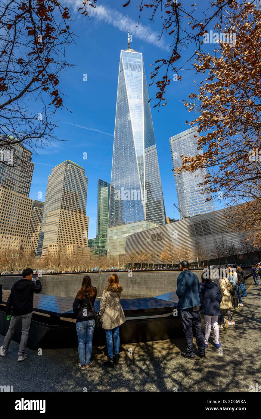 Visitors at the Memorial Fountain, South Pool of the 9/11 Memorial ...