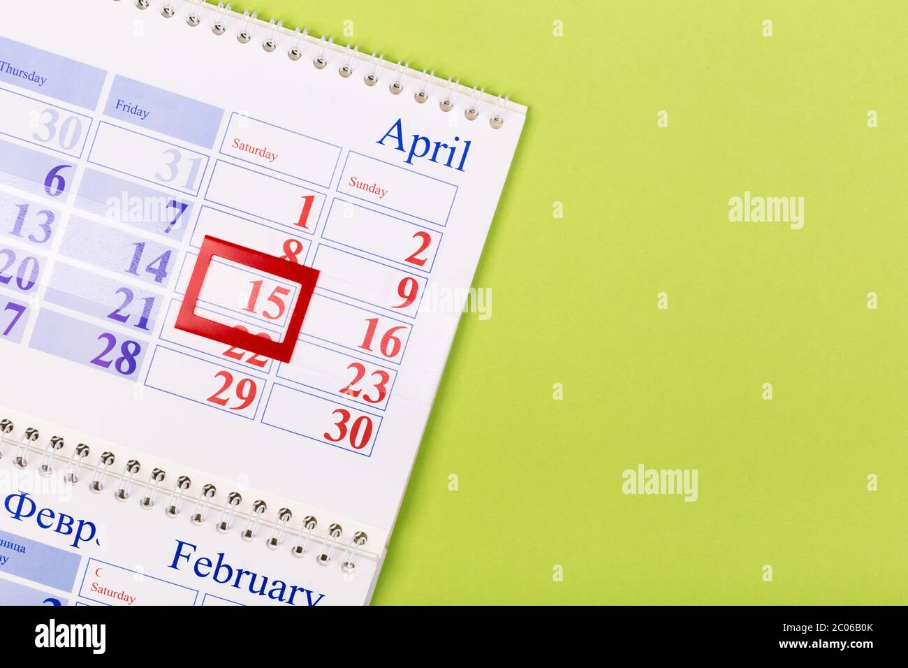 Open calendar on the table with green background, planning a business ...