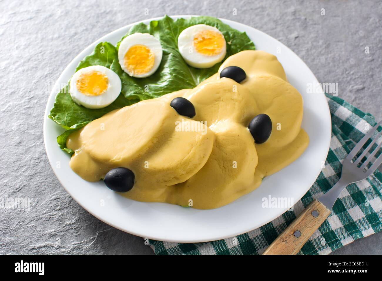 Traditional Peruvian papa a la huancaina on gray stone background Stock ...