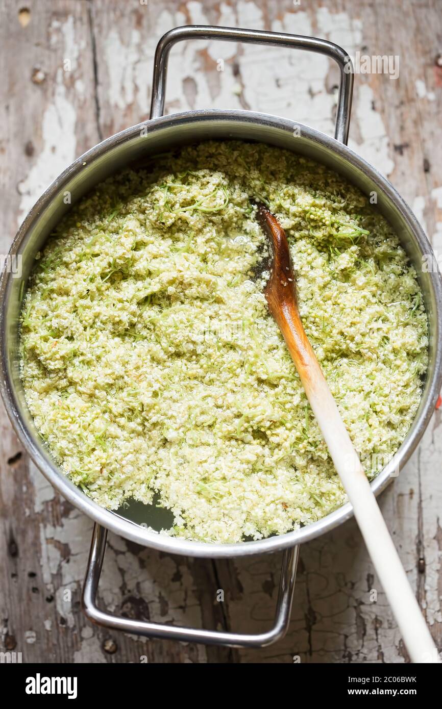 Cooking elder flower in boiling water, making elder flower cordial ...