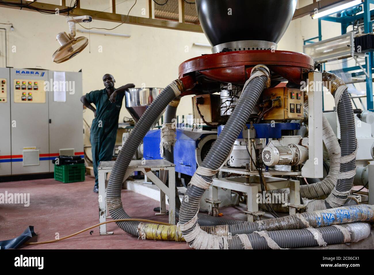 RWANDA, Kigali, plastic recycling at company Ecoplastics, extruder ...