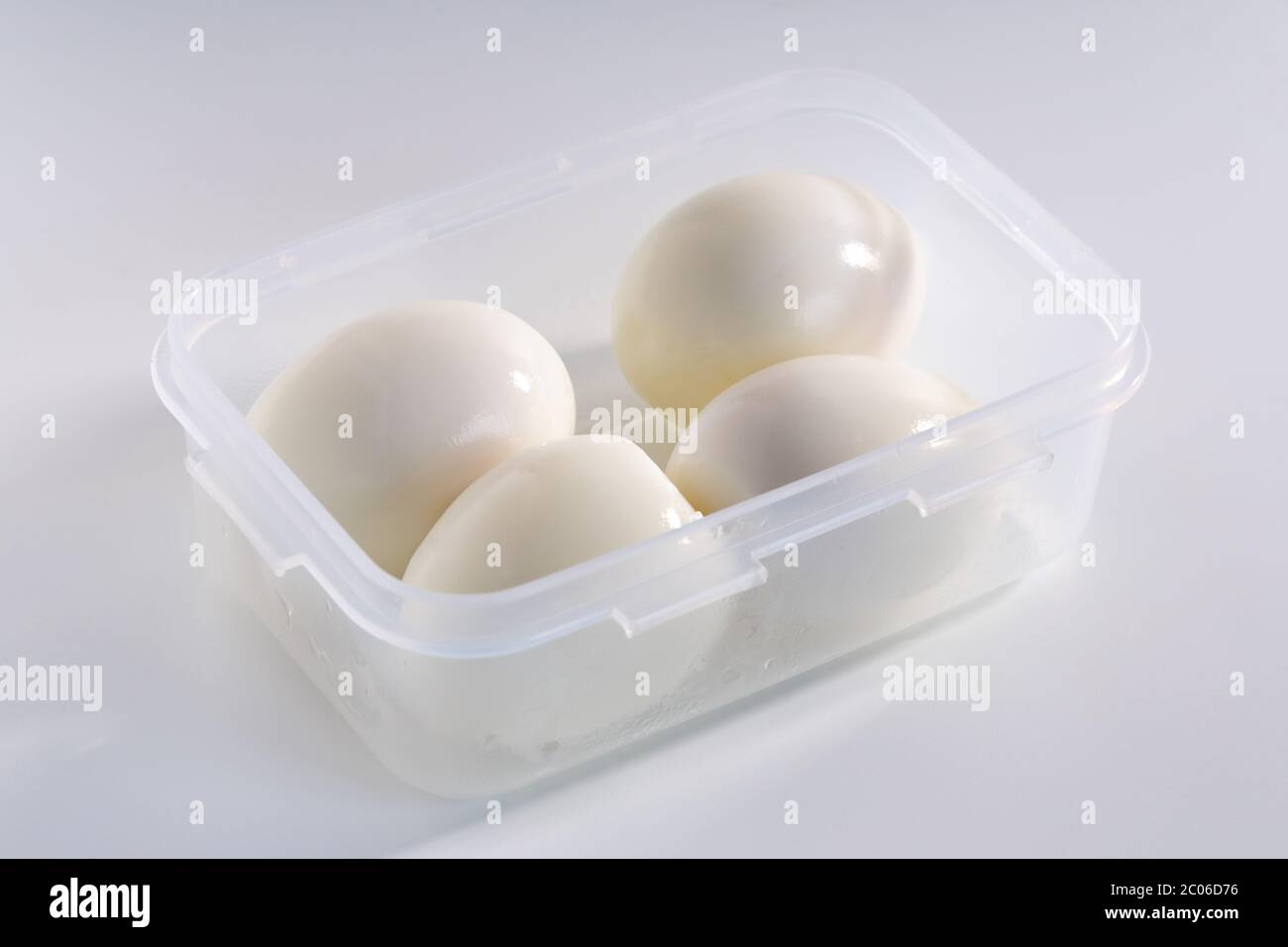 Peeled boiled chicken eggs in a plastic container Stock Photo - Alamy